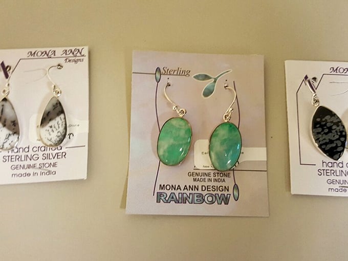 Sterling silver earrings still on their original cards&mdash;proof that "pre-loved" sometimes means "never actually worn but donated anyway."