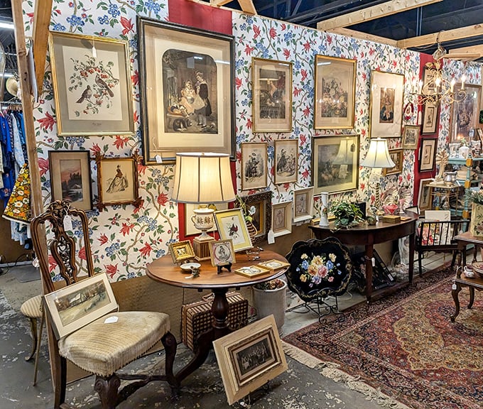 A wall of framed nostalgia against floral wallpaper creates the perfect vignette of grandma's house&mdash;if grandma had impeccable taste.