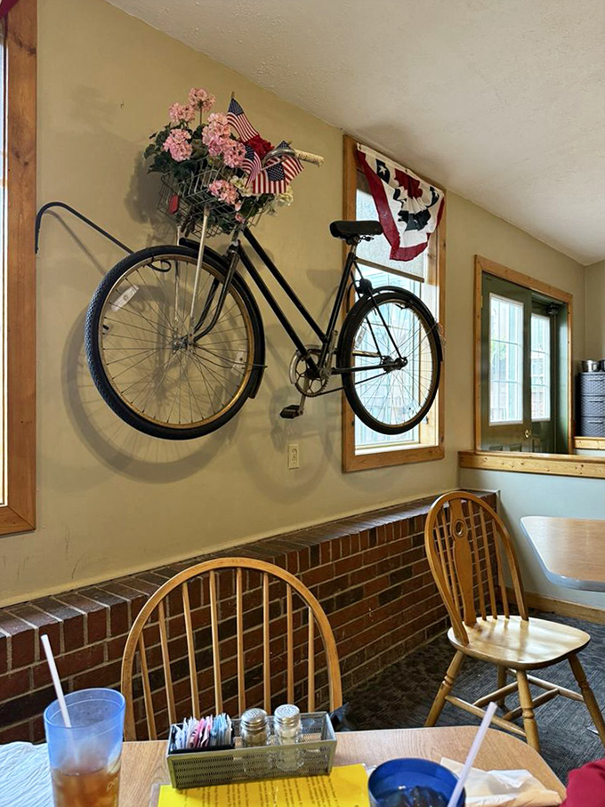 A vintage bicycle mounted on the wall proves that at Village Family Restaurant, even the d&eacute;cor tells stories of simpler times.