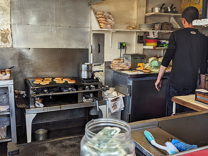 The kitchen at Bill's isn't designed for show &ndash; it's a functional workspace where burger artistry has been perfected over decades.