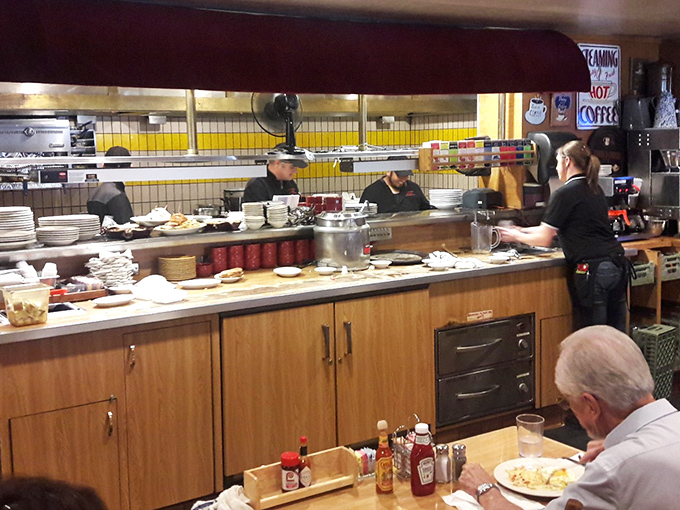 Where the magic happens. The open kitchen design lets you witness the choreographed dance of short-order cooking at its finest.