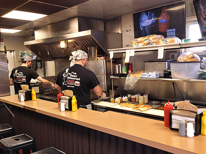 Where the magic happens. These folks move with the precision of symphony conductors, but their instruments are steam cabinets and spatulas.