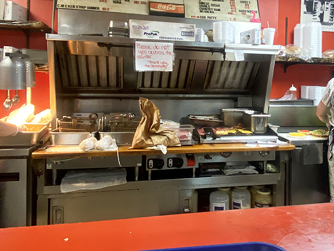 A glimpse into the kitchen reveals the unsung symphony of short-order cooking—where magic happens without molecular gastronomy or tweezers.