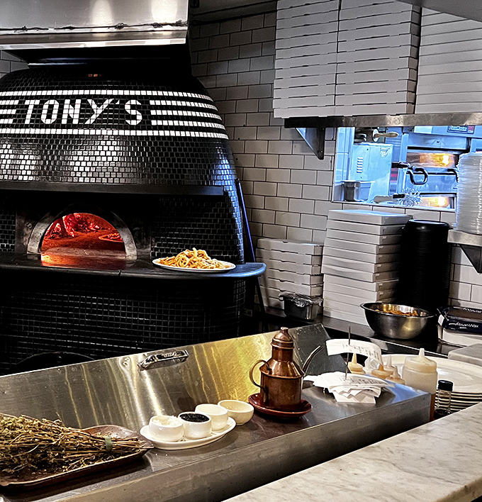 The heart of Tony's&mdash;a gleaming pizza oven that reaches the perfect Neapolitan temperatures. Pizza theater at its finest!