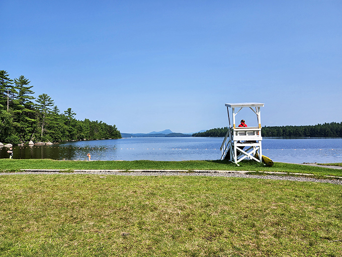 The quintessential Maine lake scene&mdash;a lifeguard chair standing watch over waters so clear you can count pebbles on the bottom.