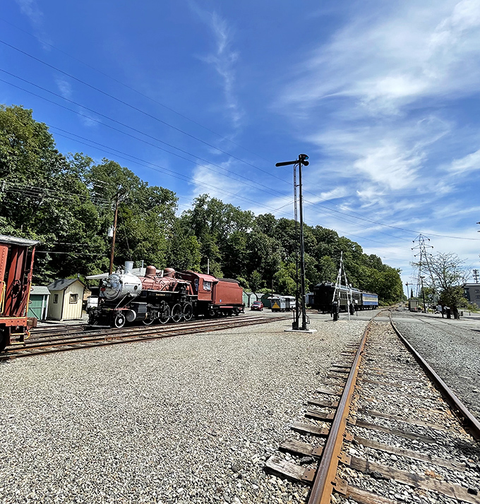 Rails stretching toward the horizon, with vintage equipment standing by. This scene captures the expansive spirit of American railroading that connected a continent.