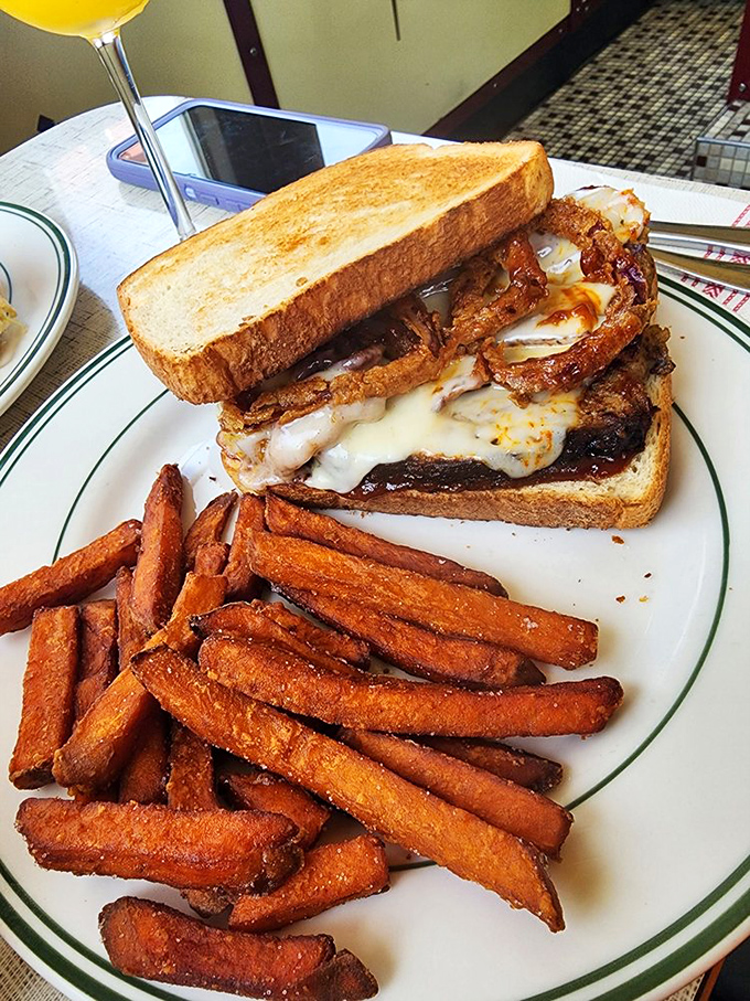 This sandwich has more layers than your favorite HBO drama. Melted cheese cascading over crispy onions creates the ultimate lunchtime plot twist. 