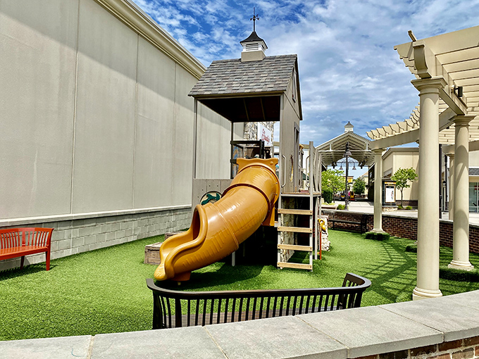 A playground slide means the kids stay entertained while you mentally calculate how many discounts equal one vacation.