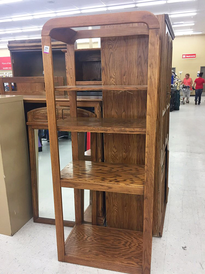 This solid oak bookshelf has stories to tell beyond the books it once held, waiting for its next chapter.