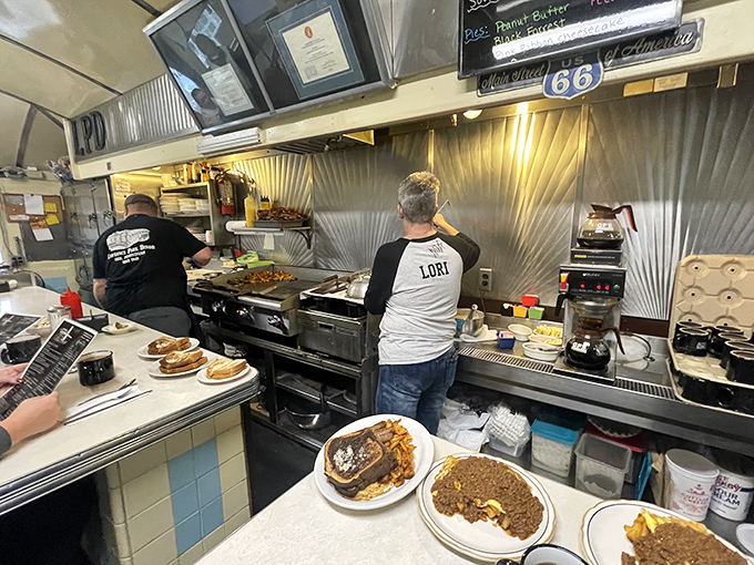 The command center where culinary magic happens&mdash;watch the masters work while your coffee stays perpetually full.