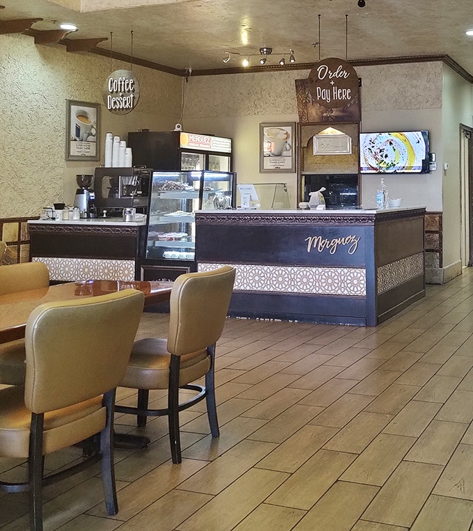 The counter where coffee dreams and dessert fantasies come true. That display case is the Vegas slot machine of sweet temptations.