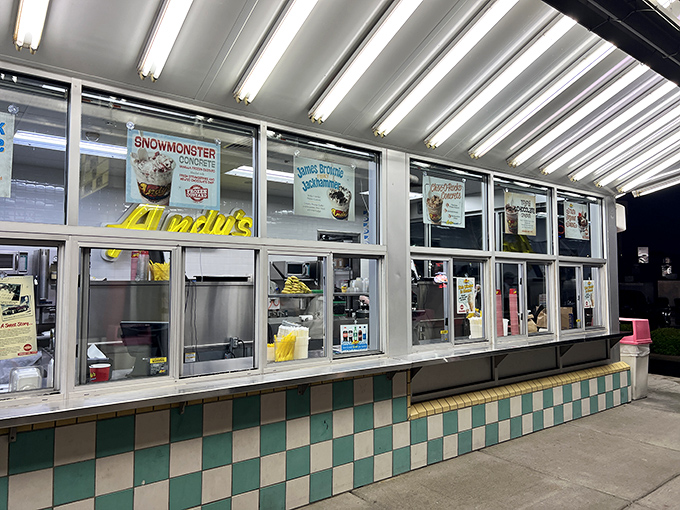Through spotless windows, the custard-making process becomes performance art, where fresh ingredients transform before your very eyes.