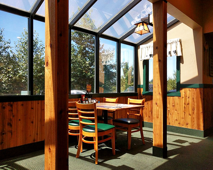 Sunlight streams through windows in this cozy nook, creating the perfect setting for maple syrup-induced happiness.