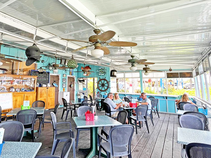Nautical charm meets practical comfort. Those ceiling fans aren't just for show&mdash;they're conducting a symphony of sea breezes and food aromas.