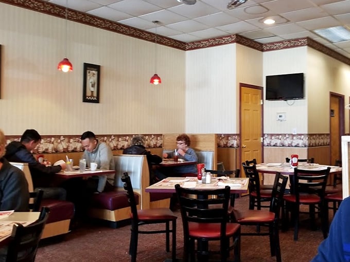 Classic diner aesthetics that transport you to a simpler time. The wall border and booth upholstery create that "I've been here before" feeling, even on your first visit.