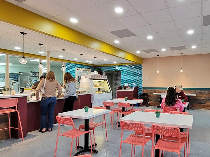 The bakery's clean lines and modern aesthetic let the pastries be the stars. Those pendant lights cast a glow that makes everything look even more tempting.