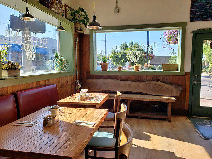 Sunlight floods the corner tables where countless conversations and coffee refills have created the perfect neighborhood vibe. Plants in the window seal the deal.
