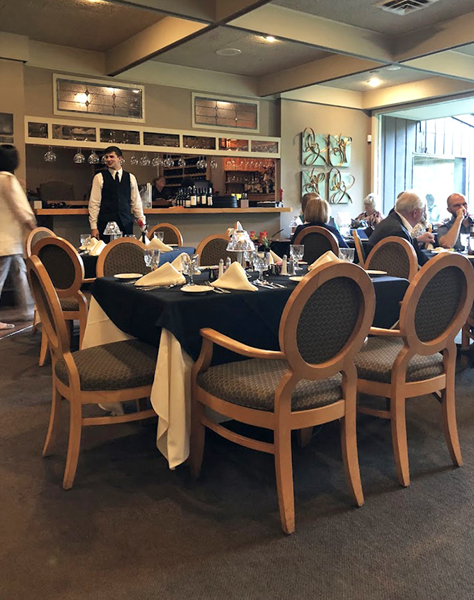 The Char's formal yet comfortable dining space, where the staff moves with practiced precision and every table feels like the best seat in the house. 