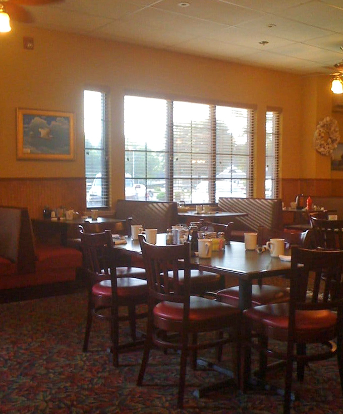 Natural light floods this corner of the dining room, creating the perfect setting for morning conversations and coffee refills.