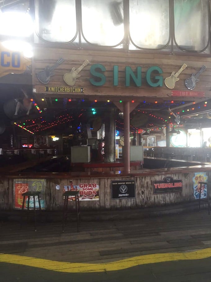 The "SING" sign promises karaoke adventures after your seafood feast &ndash; liquid courage available at the colorfully lit bar.