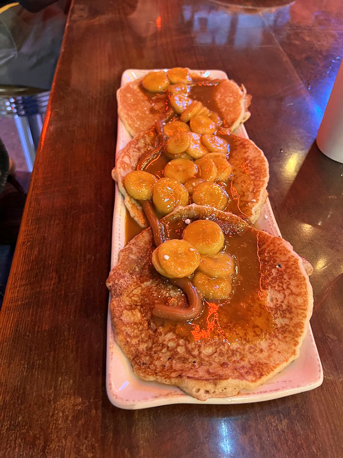 Banana pancakes drizzled with caramel&mdash;proof that sometimes the most beautiful relationships are the simplest ones, like pancakes meeting syrup.