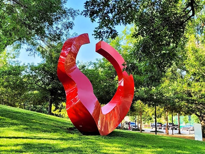 Bold, red, and impossible to ignore&mdash;this sculpture doesn't just occupy space, it commands it. Art that demands conversation.