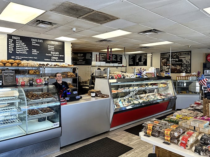 The bakery counter loaded with fresh pastries and desserts, calling to you like a siren song you absolutely should answer.