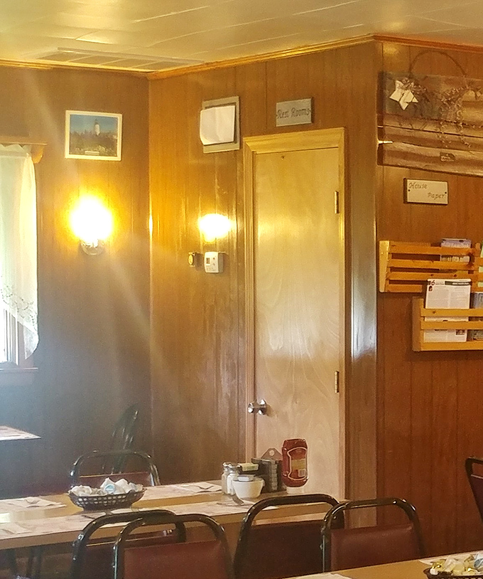 Warm wood paneling and simple wall sconces create that cozy, familiar atmosphere that makes you feel instantly at home, even on your first visit.