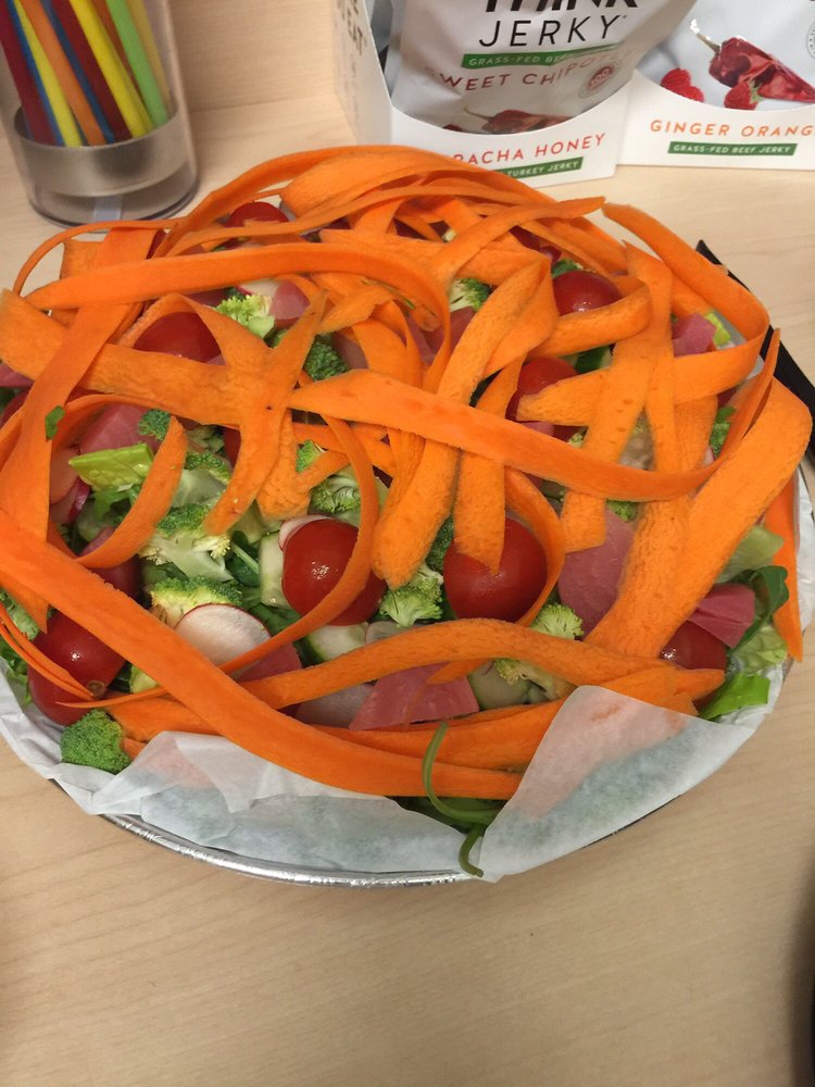Carrot ribbons dancing atop fresh vegetables&mdash;a salad that's dressed better than most people at Sunday brunch.