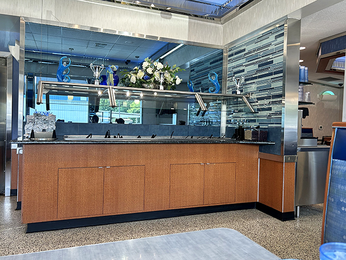 Modern blue accents and warm wood tones create that perfect balance of classic diner comfort with contemporary touches.