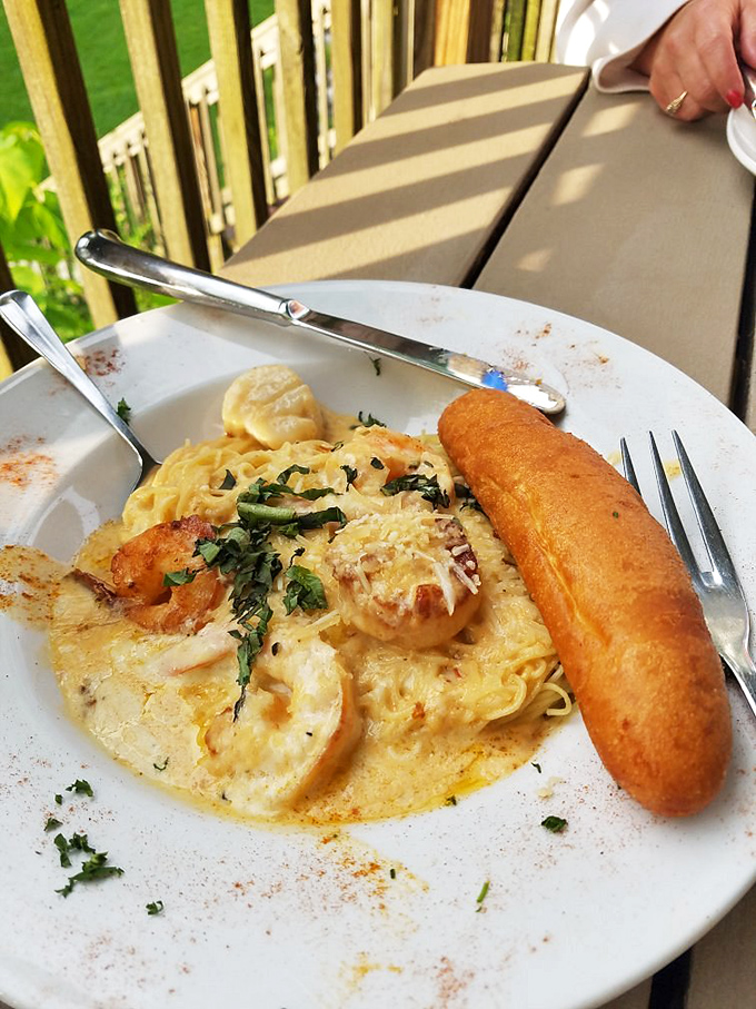 Creamy pasta cradles plump shrimp and scallops in a dish that would make Italian grandmothers nod in approval from across the Atlantic.