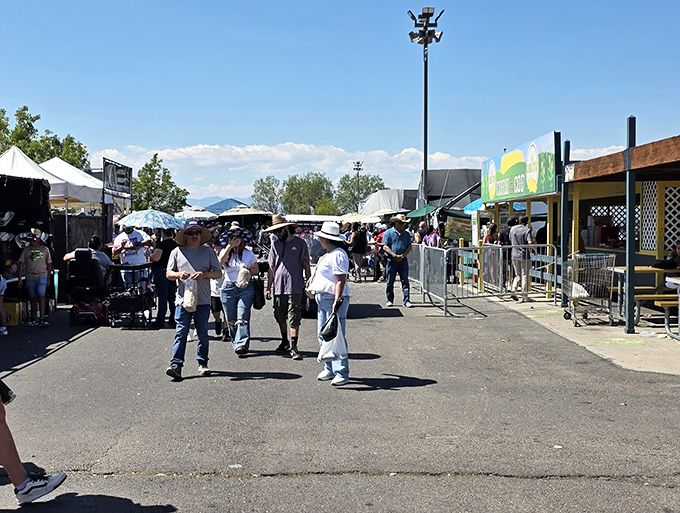 The universal flea market uniform: comfortable shoes, sun hats, and the determined look of people on a mission for bargains.
