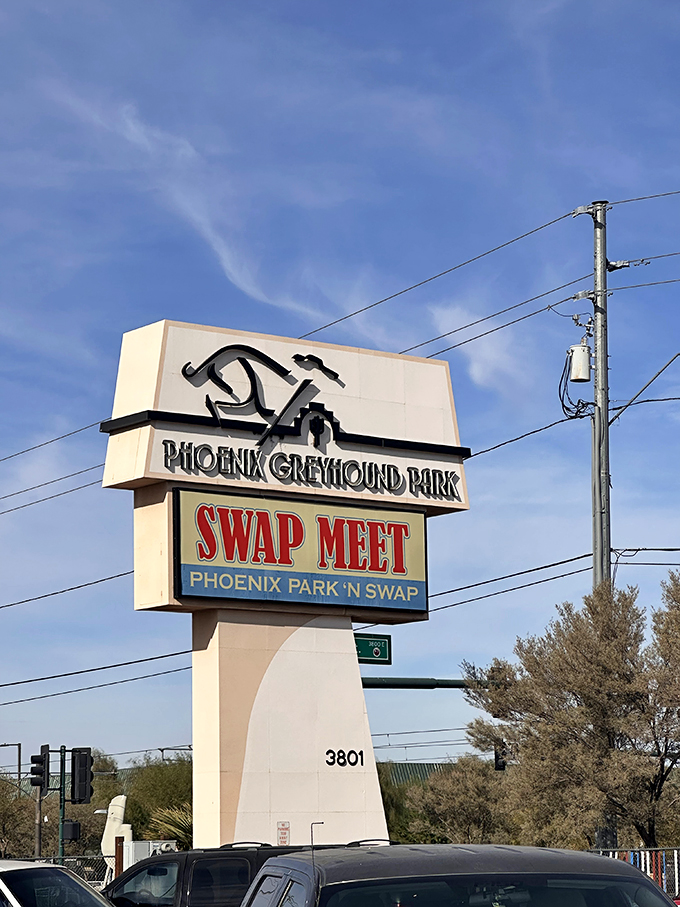 The iconic sign stands tall against Arizona's impossibly blue sky, a beacon calling bargain hunters to this desert retail playground since decades past.
