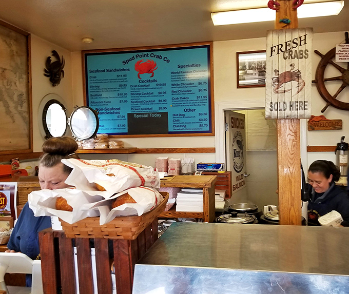 Inside the compact kitchen where seafood magic happens. The maritime d&eacute;cor isn't for show &ndash; it's a reflection of the authentic coastal experience you're about to enjoy.