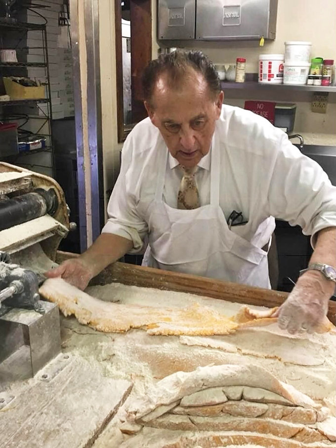 Hands that have made pasta for decades don't measure ingredients—they feel the dough's readiness through decades of muscle memory.