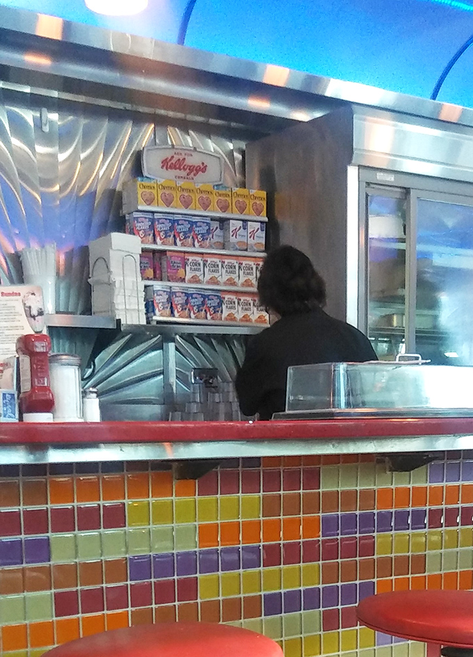 Behind every great diner is a kitchen where breakfast dreams come true. Those cereal boxes aren't decoration&mdash;they're promises of morning happiness.