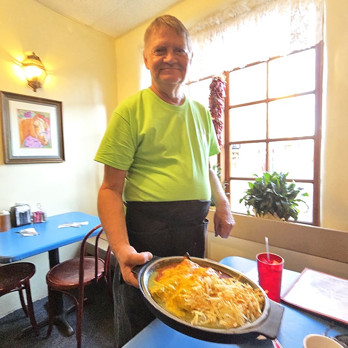 The pride of service shines brighter than the plate of enchiladas. Decades of culinary tradition delivered with a smile.