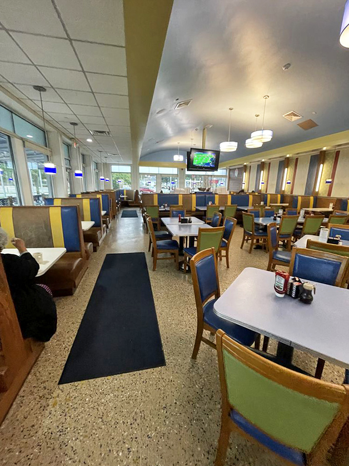 The dining room – spacious, comfortable, and ready for everything from first dates to family reunions. Those blue chairs have heard some stories.