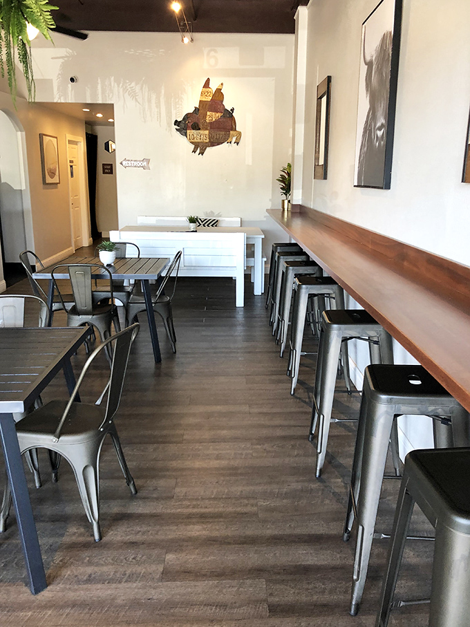 Modern industrial meets California casual in this dining space. Metal stools and wooden tables create the perfect backdrop for the meat-centric masterpieces to come.