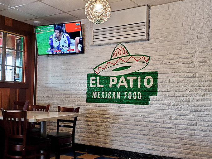 Even the walls tell stories here. That sombrero logo painted on white brick has probably photobombed more family memories than Uncle Bob at Thanksgiving.