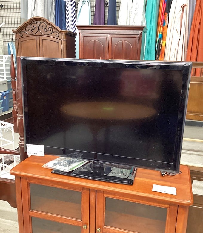 Entertainment center jackpot! This flatscreen and media cabinet combo is ready to become the heart of someone's living room.
