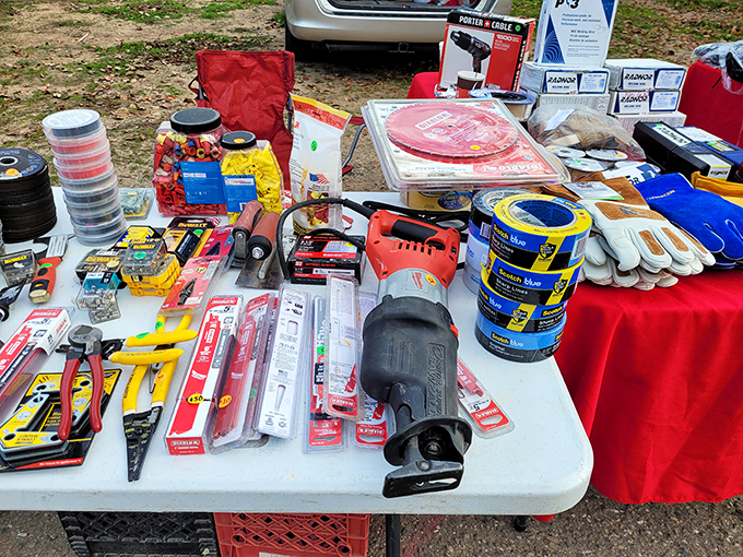Tool paradise for the handy and hopeful alike. From duct tape to power tools, this table has everything needed to fix what's broken or break what's fixed.