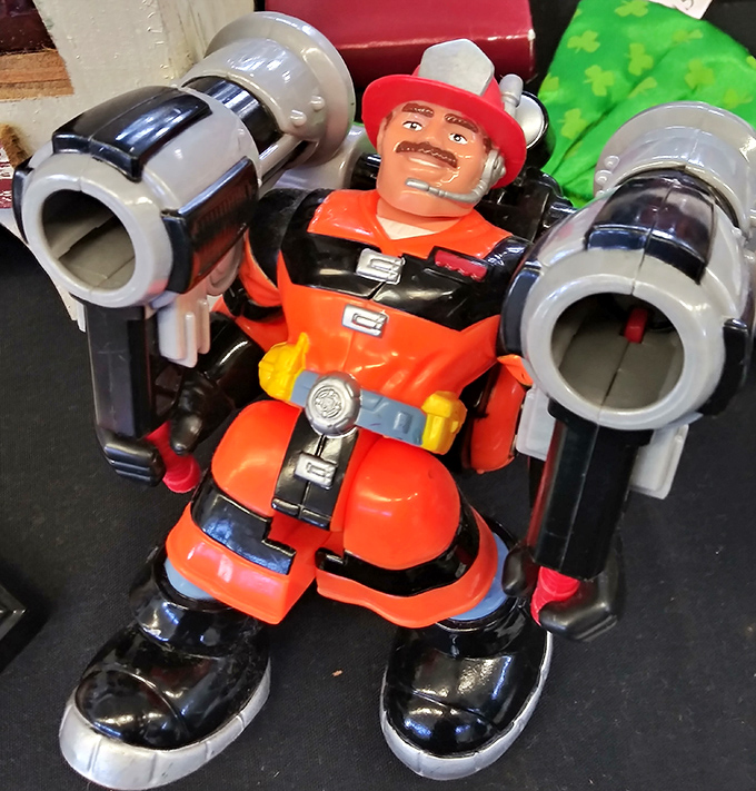 This vintage firefighter toy stands ready for imaginary emergencies, a plastic hero from the days when toys were built to survive childhood.