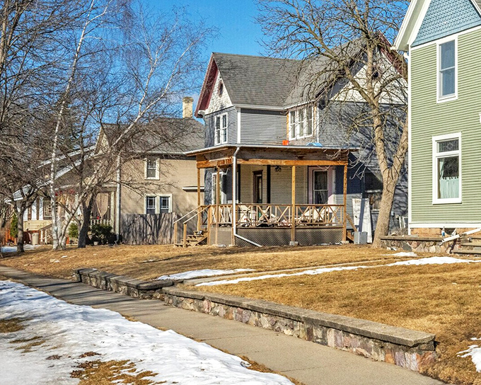 Front porches on these homes suggest an era when evening conversation didn't require WiFi or streaming subscriptions.