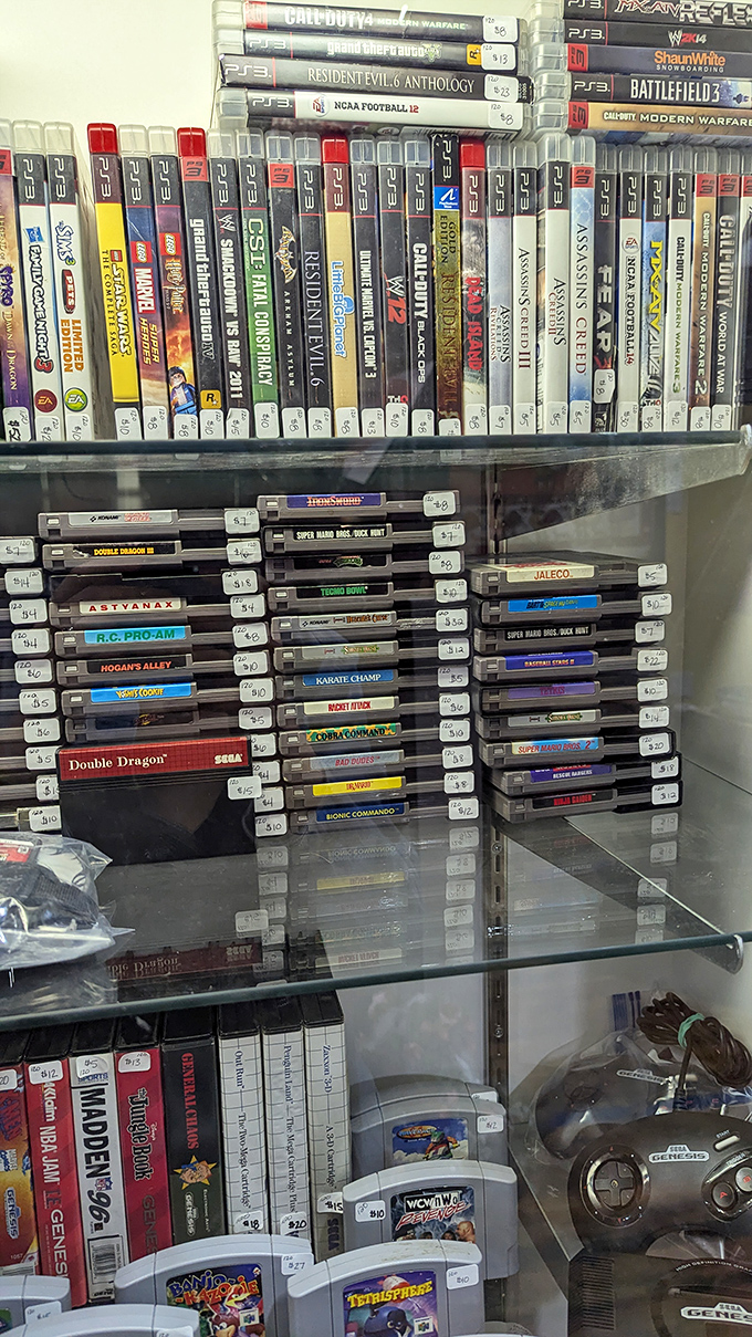Video game history displayed like archaeological finds. From NES to PS3, these plastic cartridges once transported kids to worlds their parents couldn't understand.