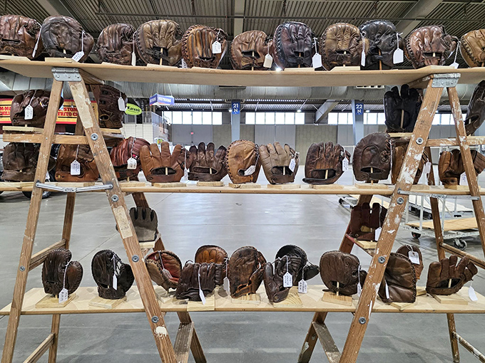 Baseball gloves lined up like leather soldiers, each one holding memories of summer games and childhood heroes.