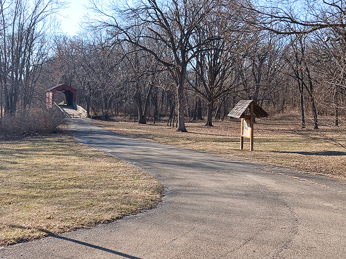 The path to the bridge offers its own quiet charm, a prelude to the main architectural attraction ahead.