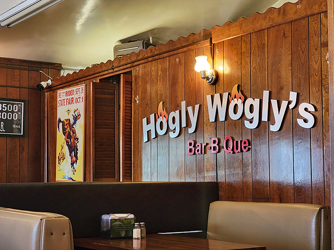 The wall proudly announces what your nose already knew. In the church of smoke and fire, these wood panels have witnessed countless conversions.