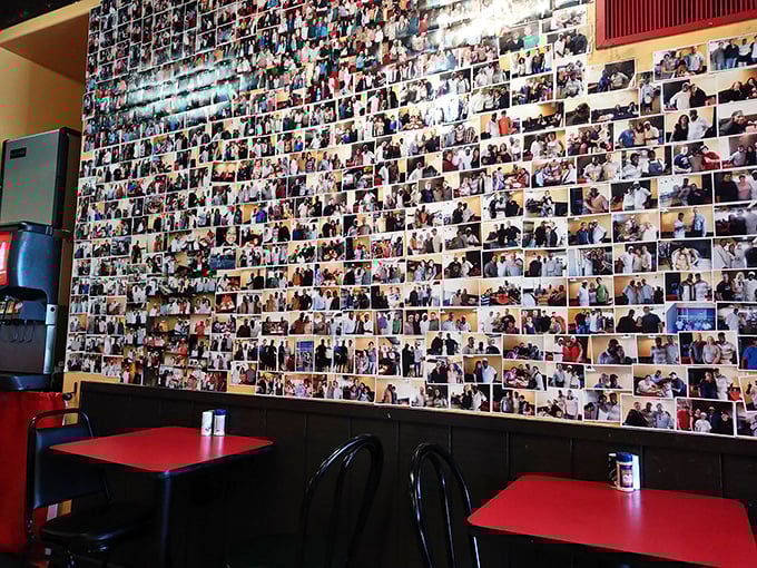 The wall of photos isn't decoration&mdash;it's a visual guestbook chronicling decades of satisfied customers and their happy stomachs.