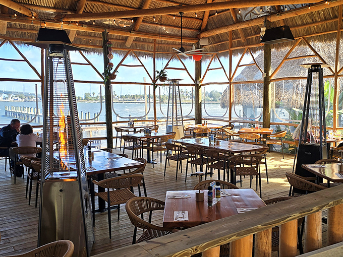 Waterfront dining with a view that makes you wonder why you ever eat indoors. Those palm fronds are nature's air conditioning.